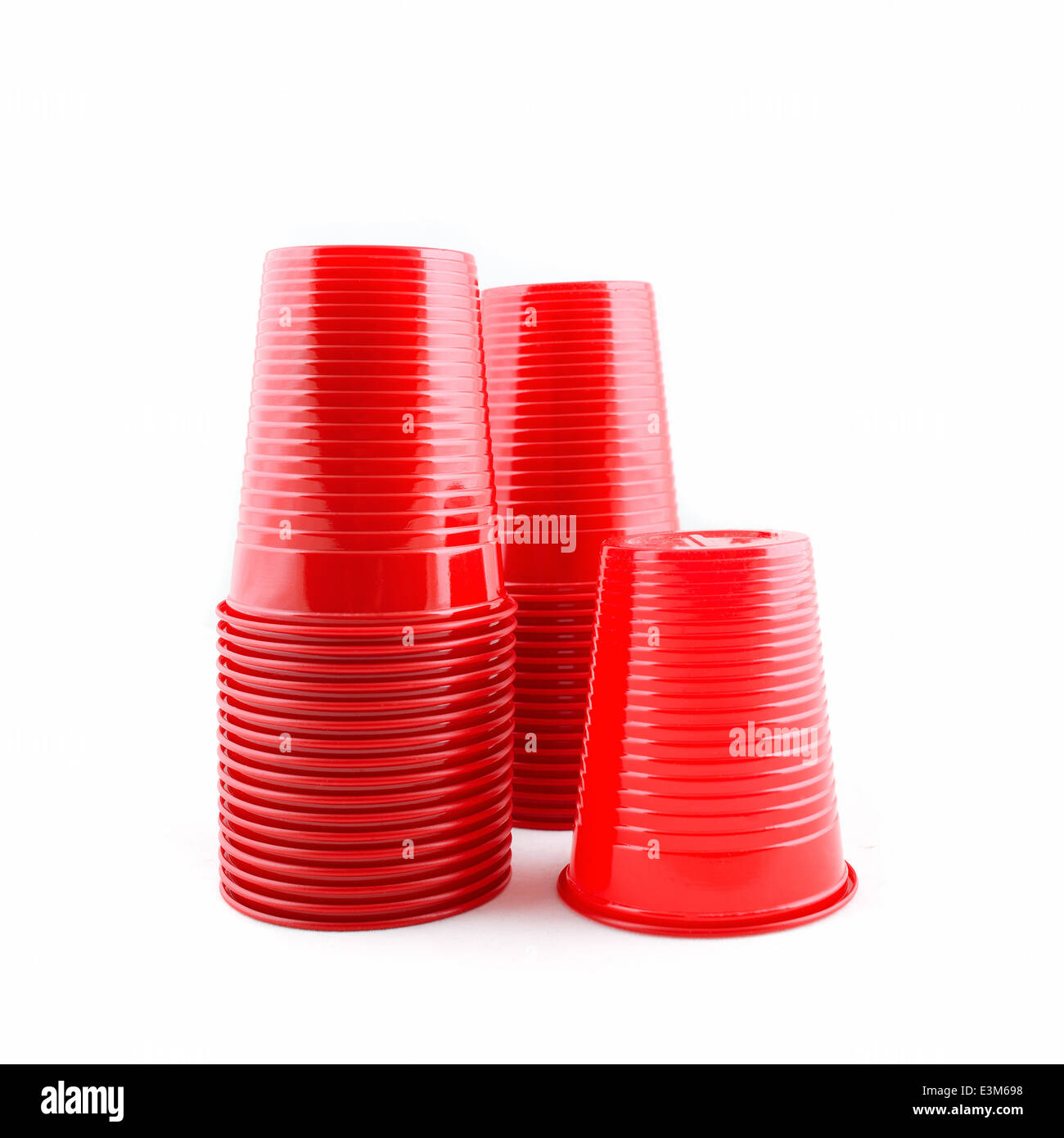 Plastic red cups stacks isolated on white background Stock Photo - Alamy