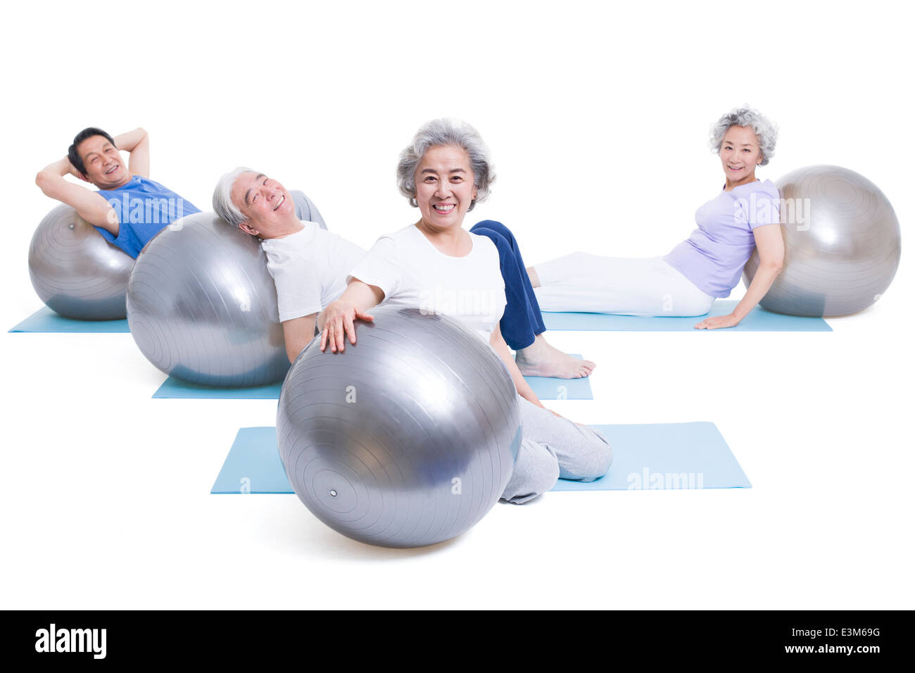 Senior adults having a rest after exercising Stock Photo - Alamy