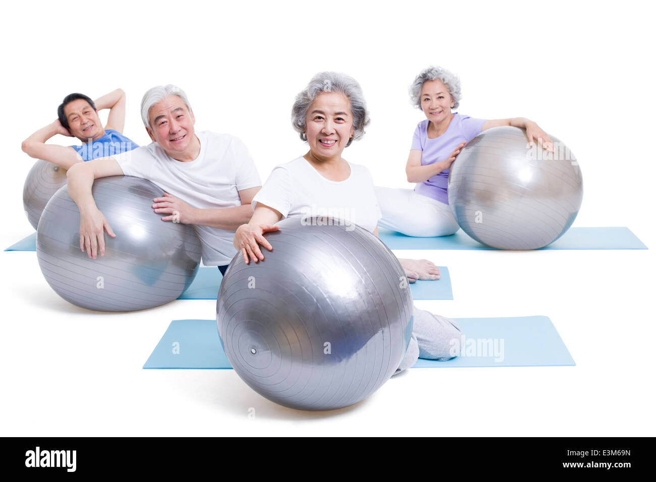 Senior adults having a rest after exercising Stock Photo - Alamy