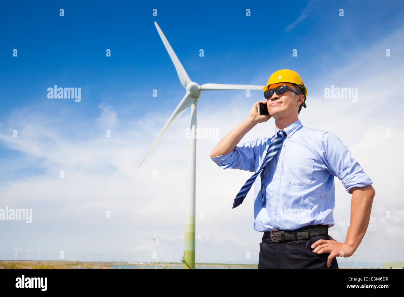 professional business standing with wind generator Stock Photo - Alamy