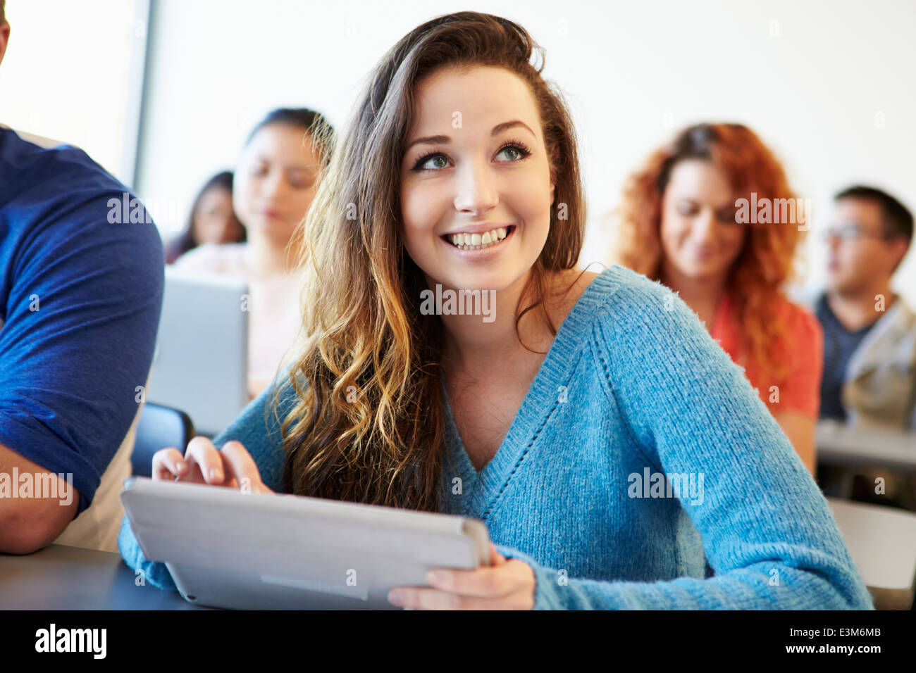 Female University Student Using Digital Tablet In Classroom Stock Photo ...