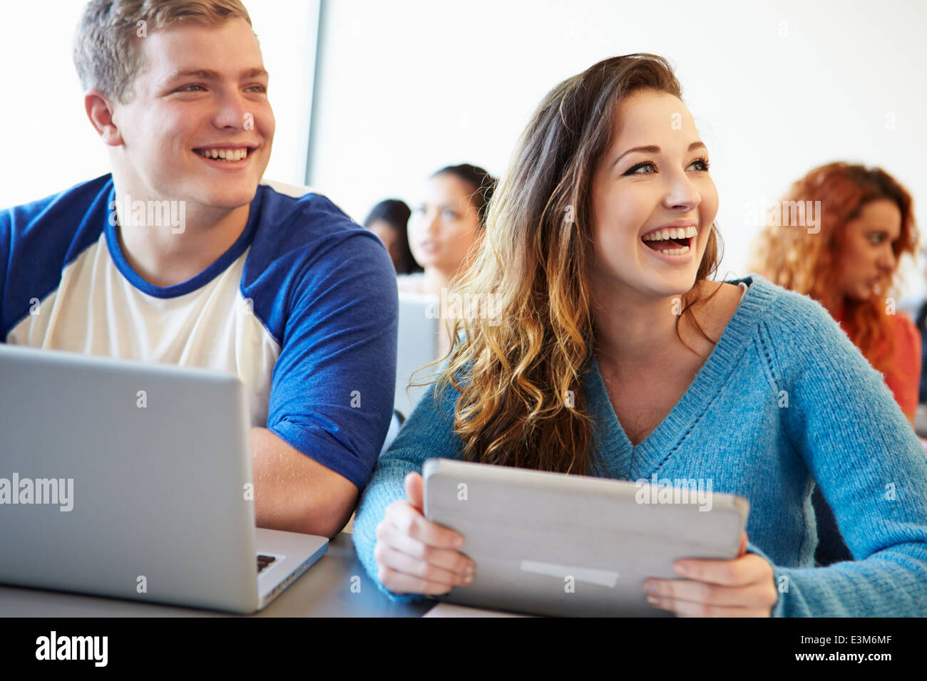 University Students Using Digital Tablet And Laptop In Class Stock ...