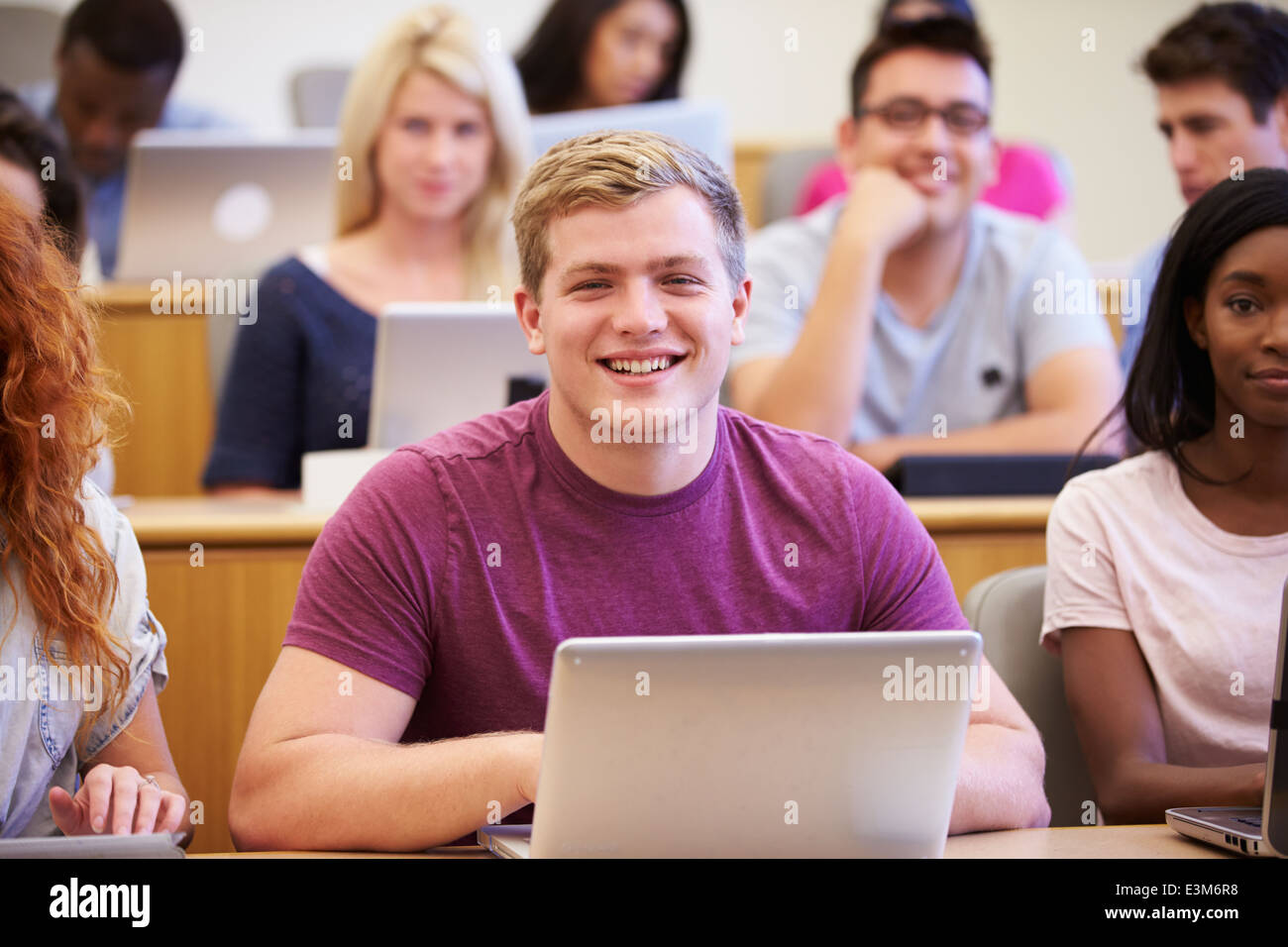 Male University Student Using Laptop In Lecture Stock Photo - Alamy