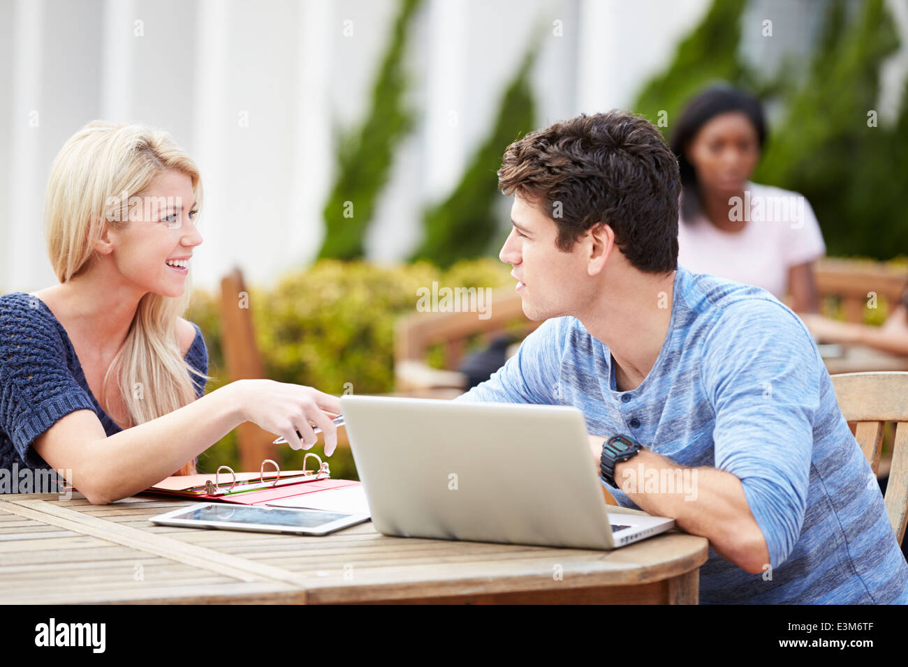 Two University Students Working On Project Outdoors Together Stock ...