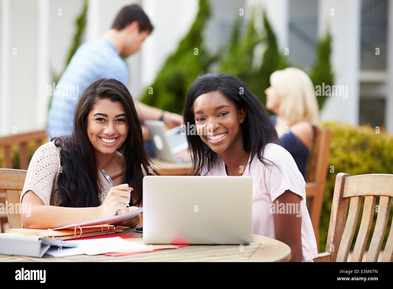 Two University Students Working On Project Outdoors Together Stock ...