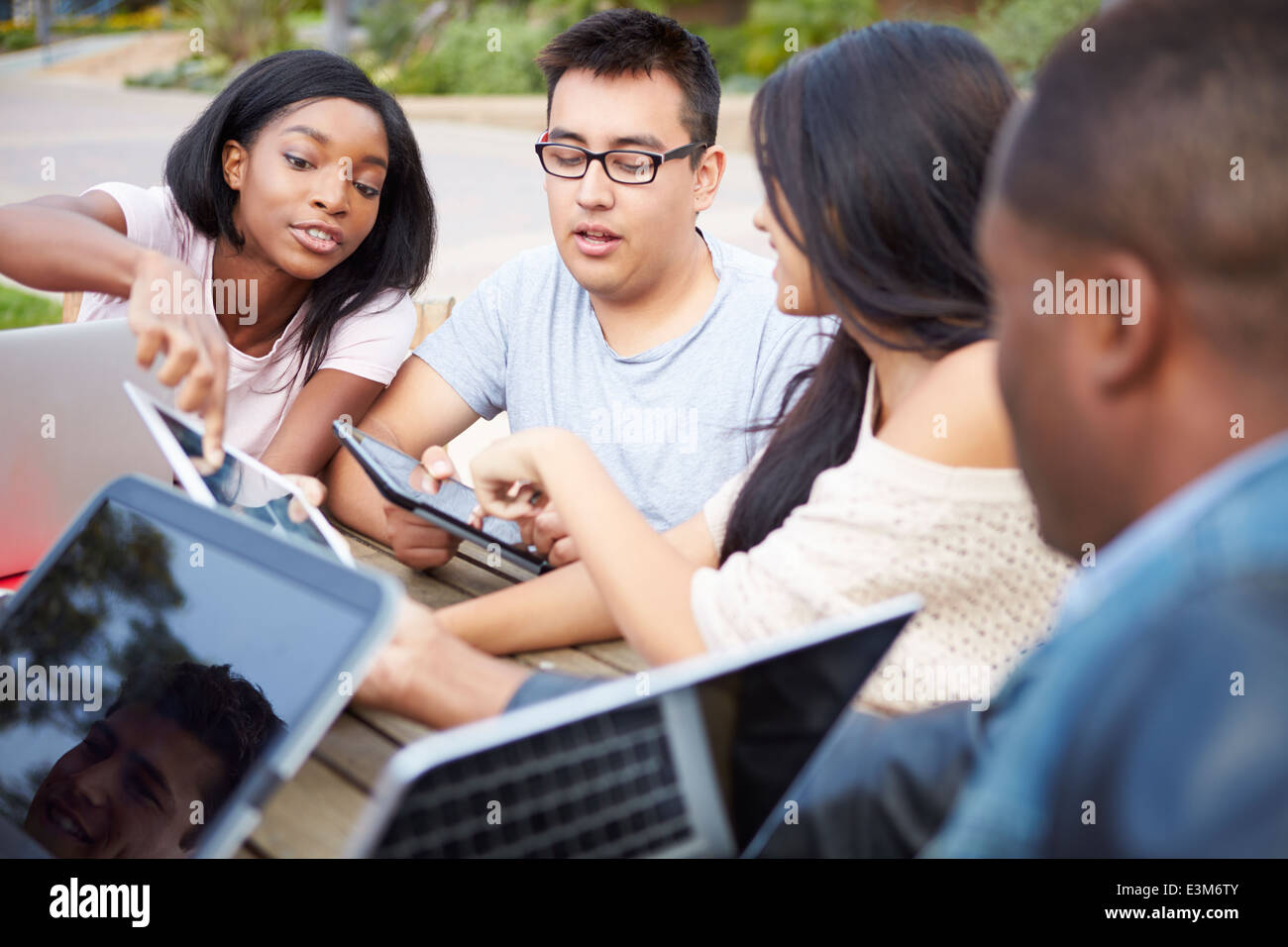 Group Of University Students Working On Project Outdoors Stock Photo ...