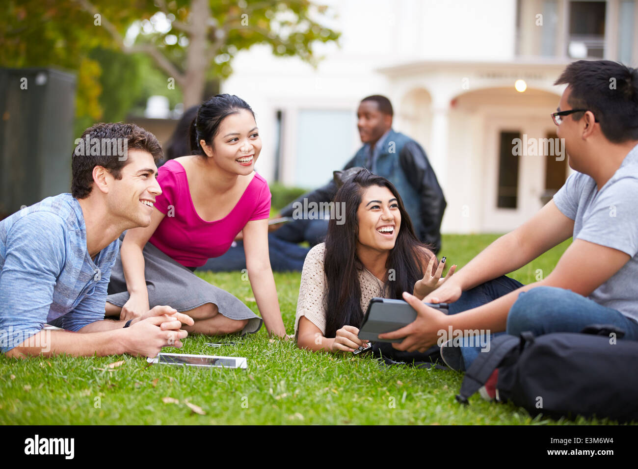 Group Of University Students Working Outside Together Stock Photo - Alamy