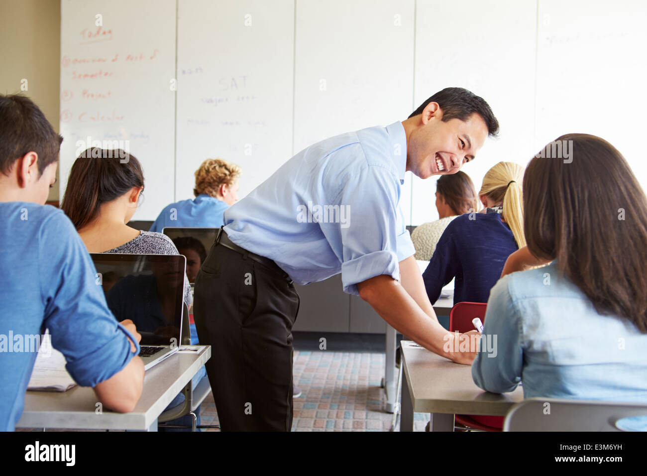 Tutor Helping High School Students In Class Stock Photo - Alamy