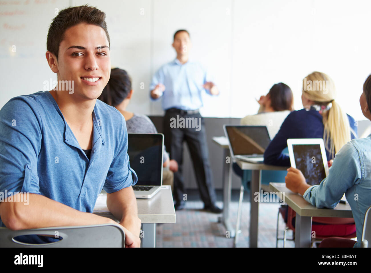 Male High School Student Using Laptop In Classroom Stock Photo - Alamy