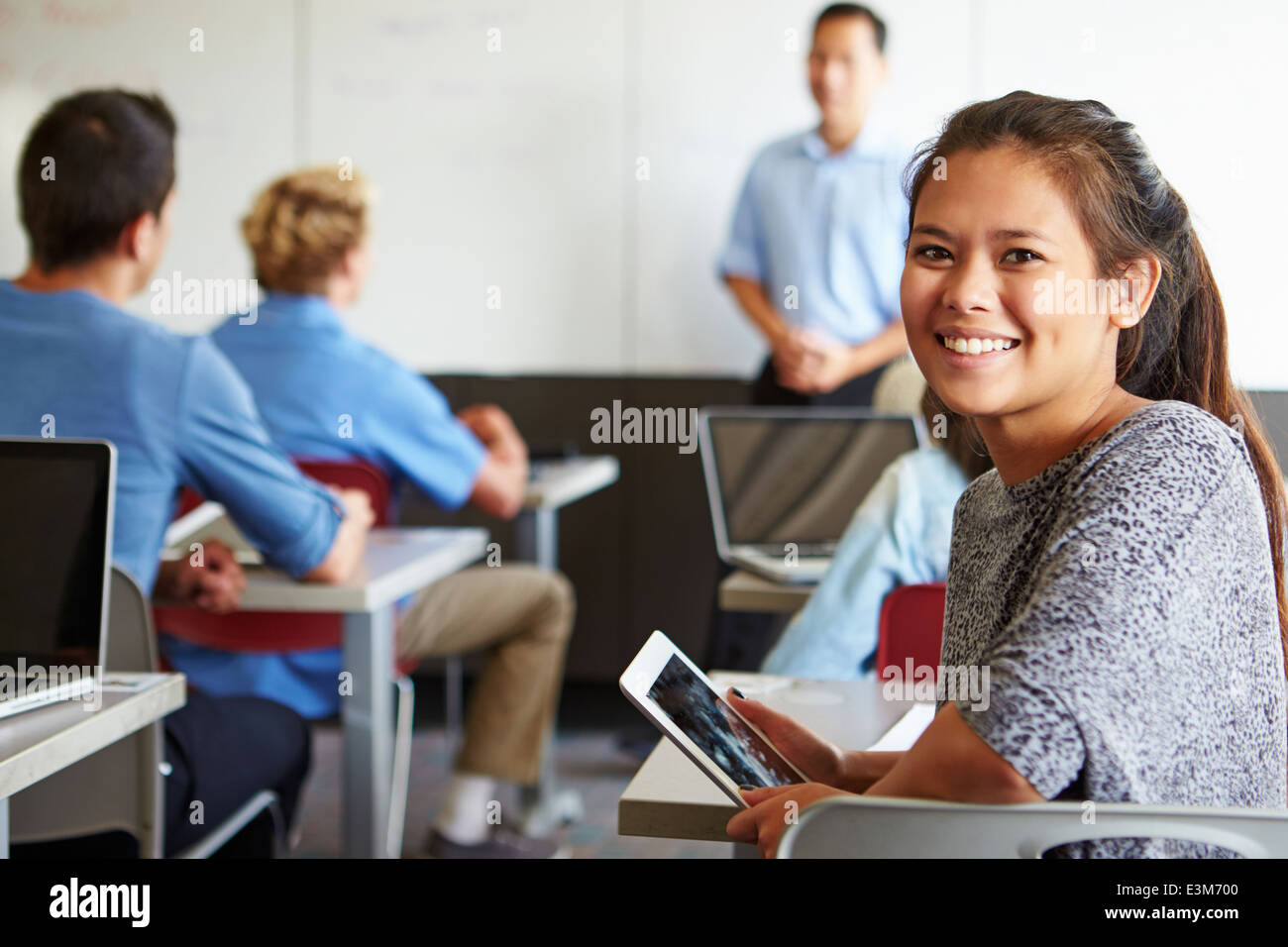 Female High School Student Digital Tablet In Classroom Stock Photo - Alamy