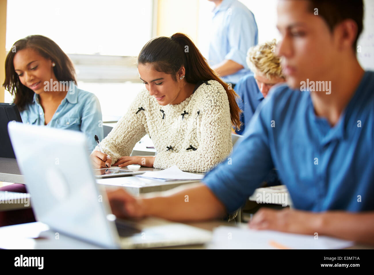 Students using laptop in class hi-res stock photography and images - Alamy