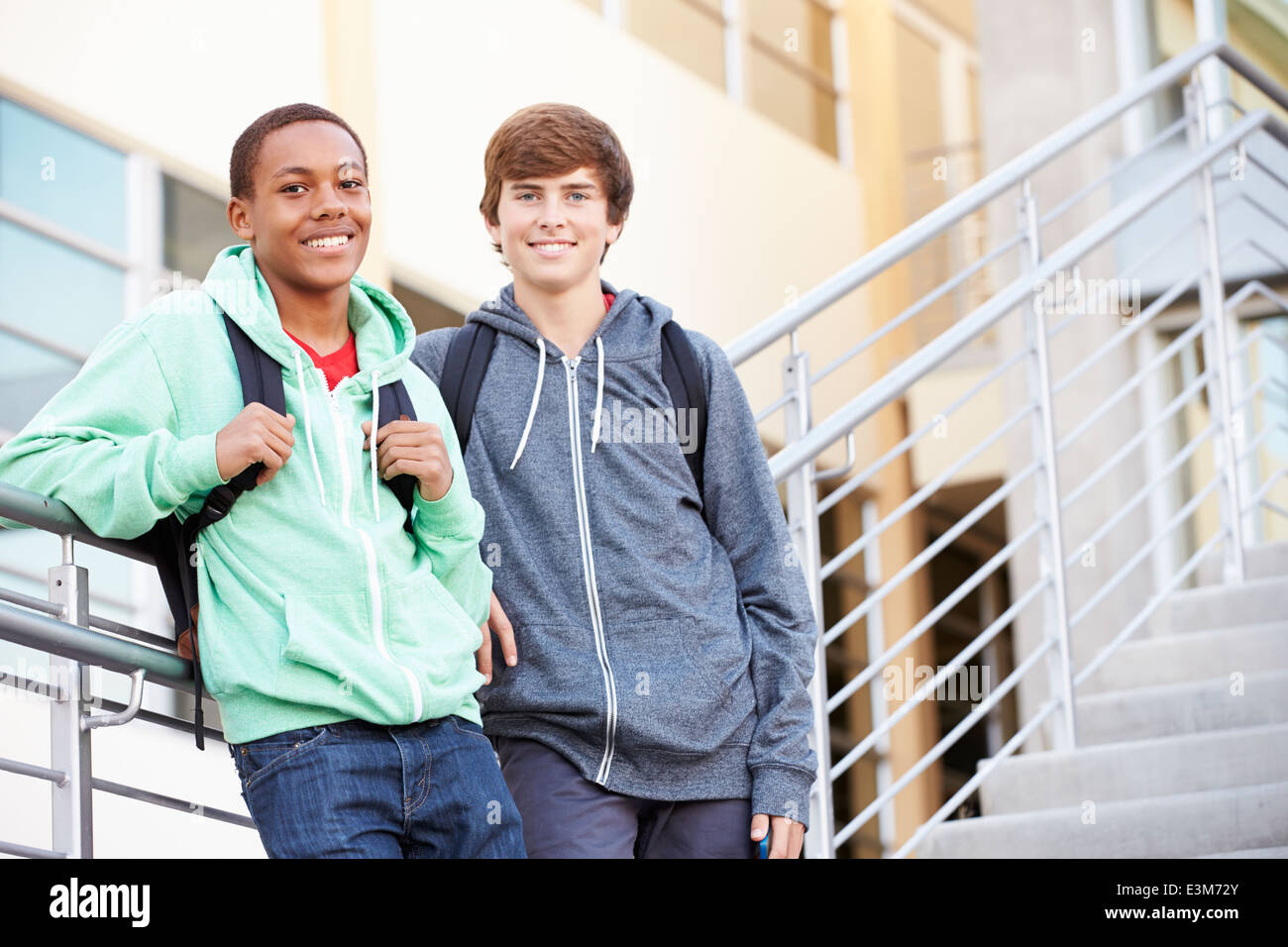Two Male High School Students Standing Outside Building Stock Photo - Alamy