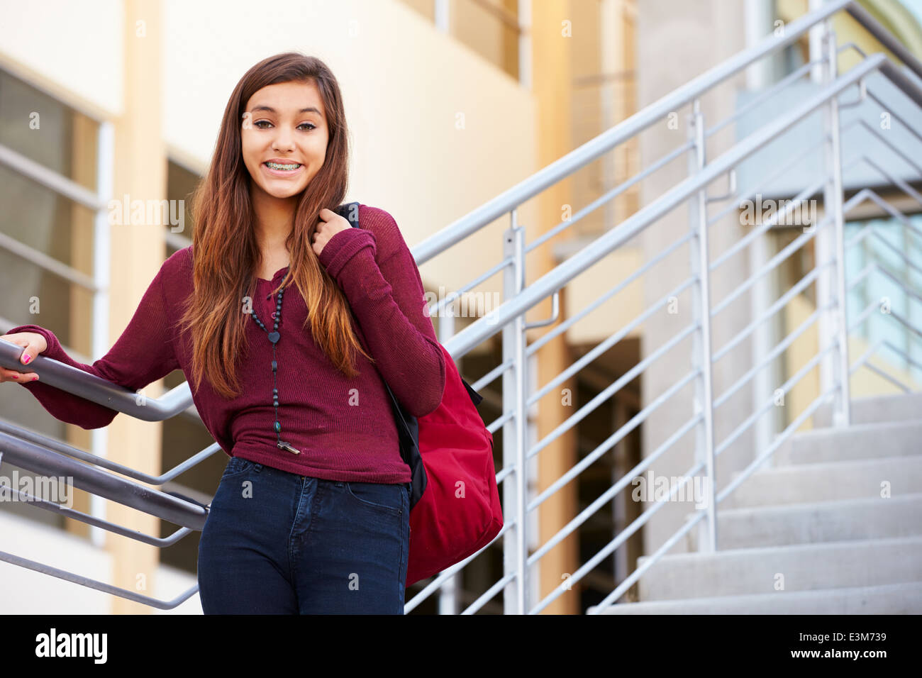 Female High School Student Standing Outside Building Stock Photo - Alamy