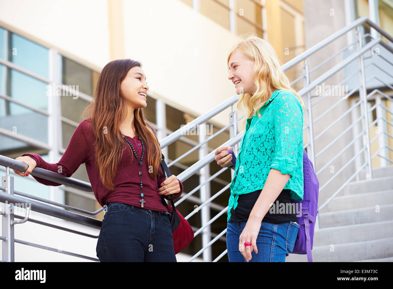 Two Female High School Students Standing Outside Building Stock Photo ...