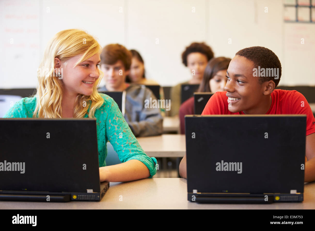 Group Of High School Students In Class Using Laptops Stock Photo - Alamy