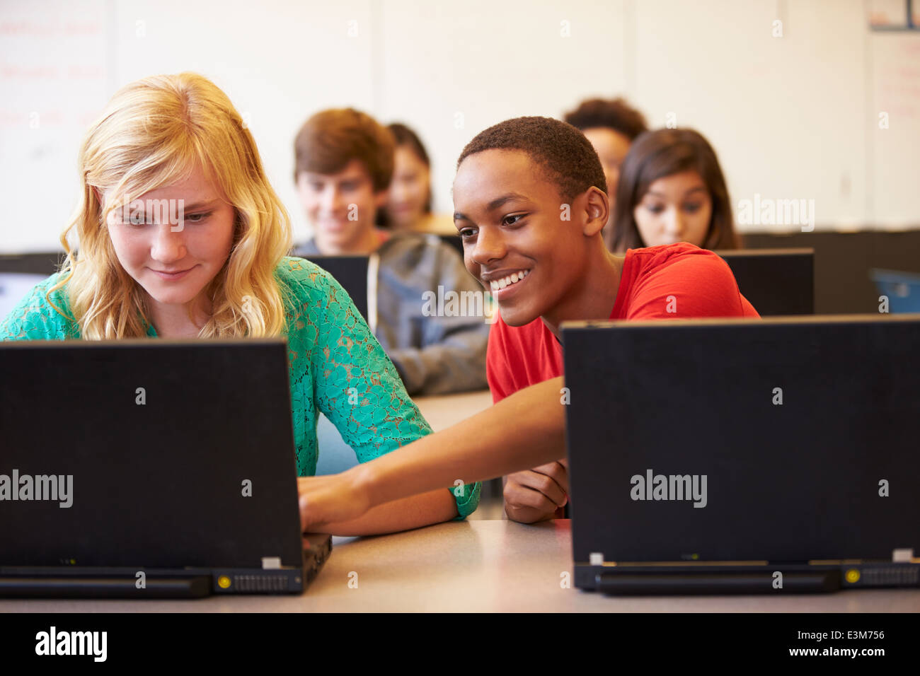 Group Of High School Students In Class Using Laptops Stock Photo - Alamy