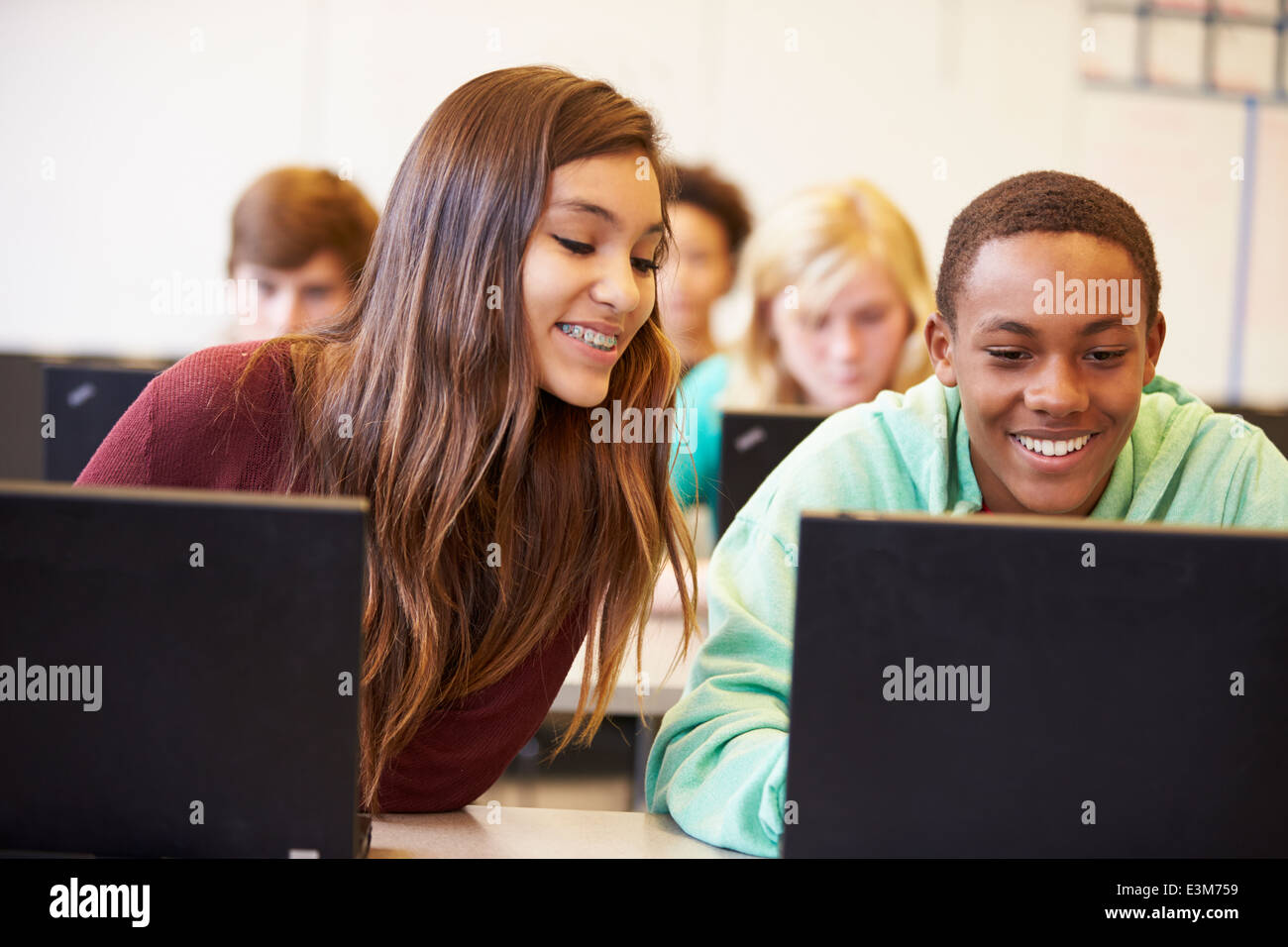 Group Of High School Students In Class Using Laptops Stock Photo - Alamy