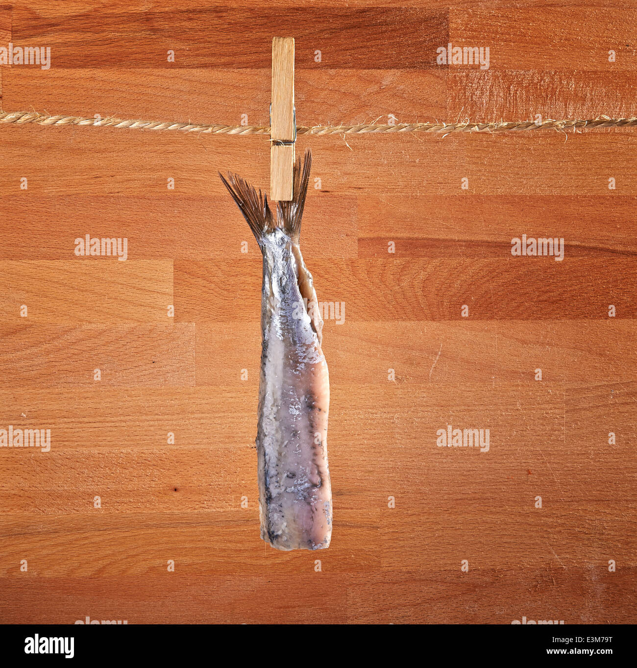 Typical Dutch salted herring called maatje or zoute haring hanging on a ...