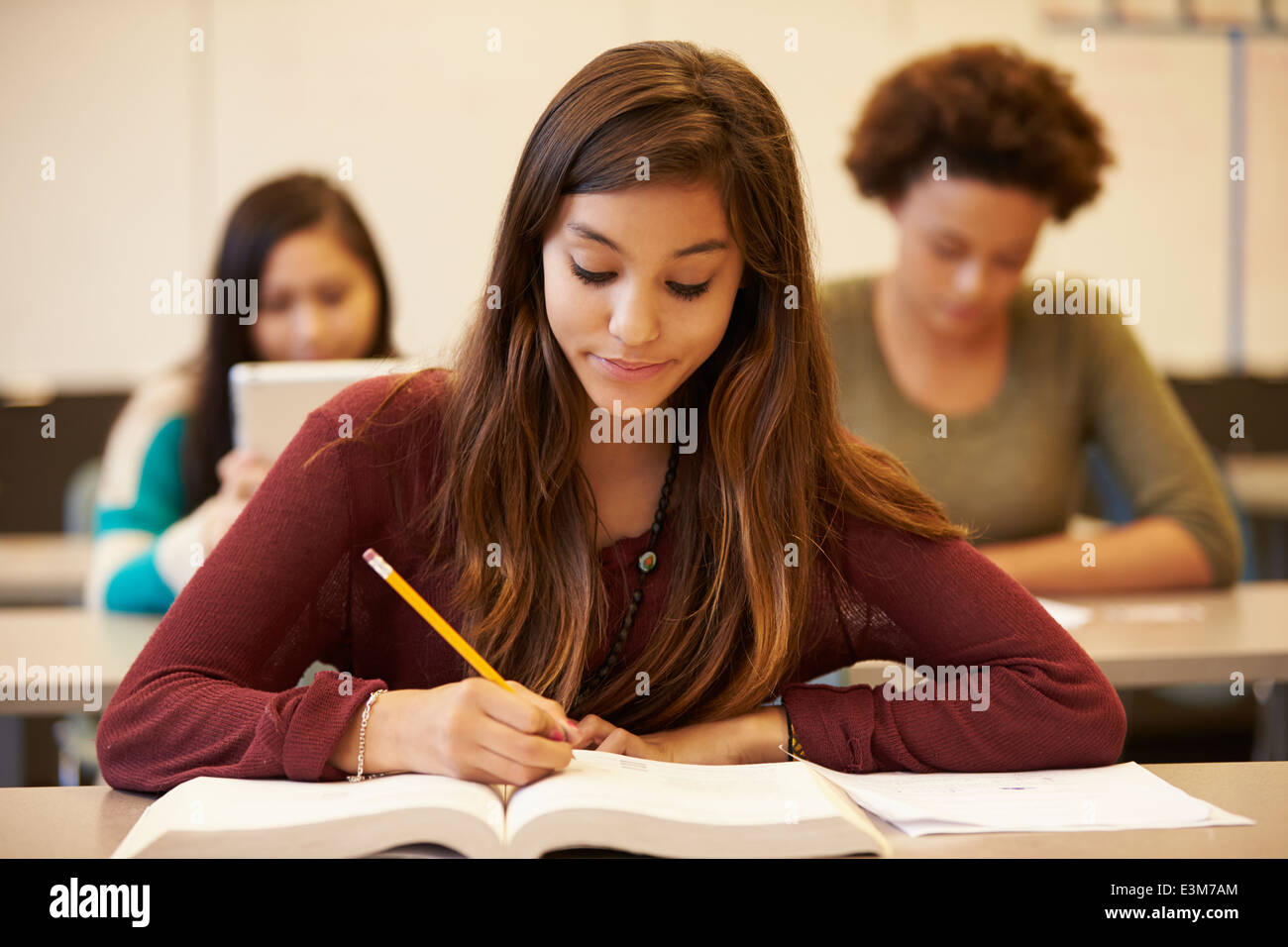 Female student studying in classroom hi-res stock photography and ...