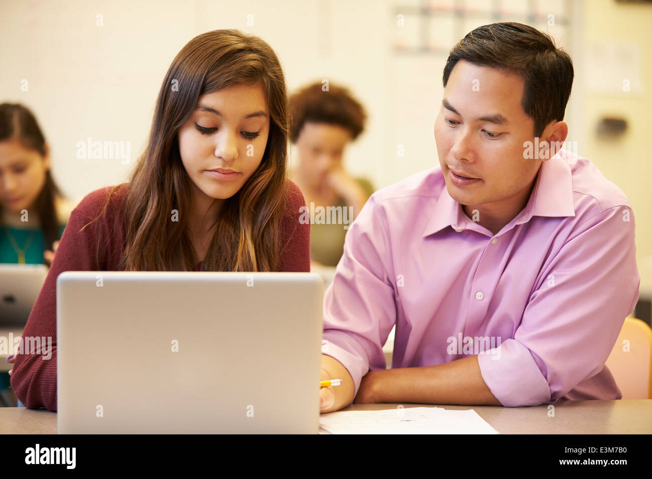 High School Student With Teacher In Class Using Laptop Stock Photo - Alamy