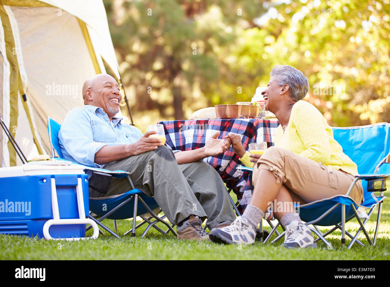 Senior Couple Enjoying Camping Holiday In Countryside Stock Photo - Alamy