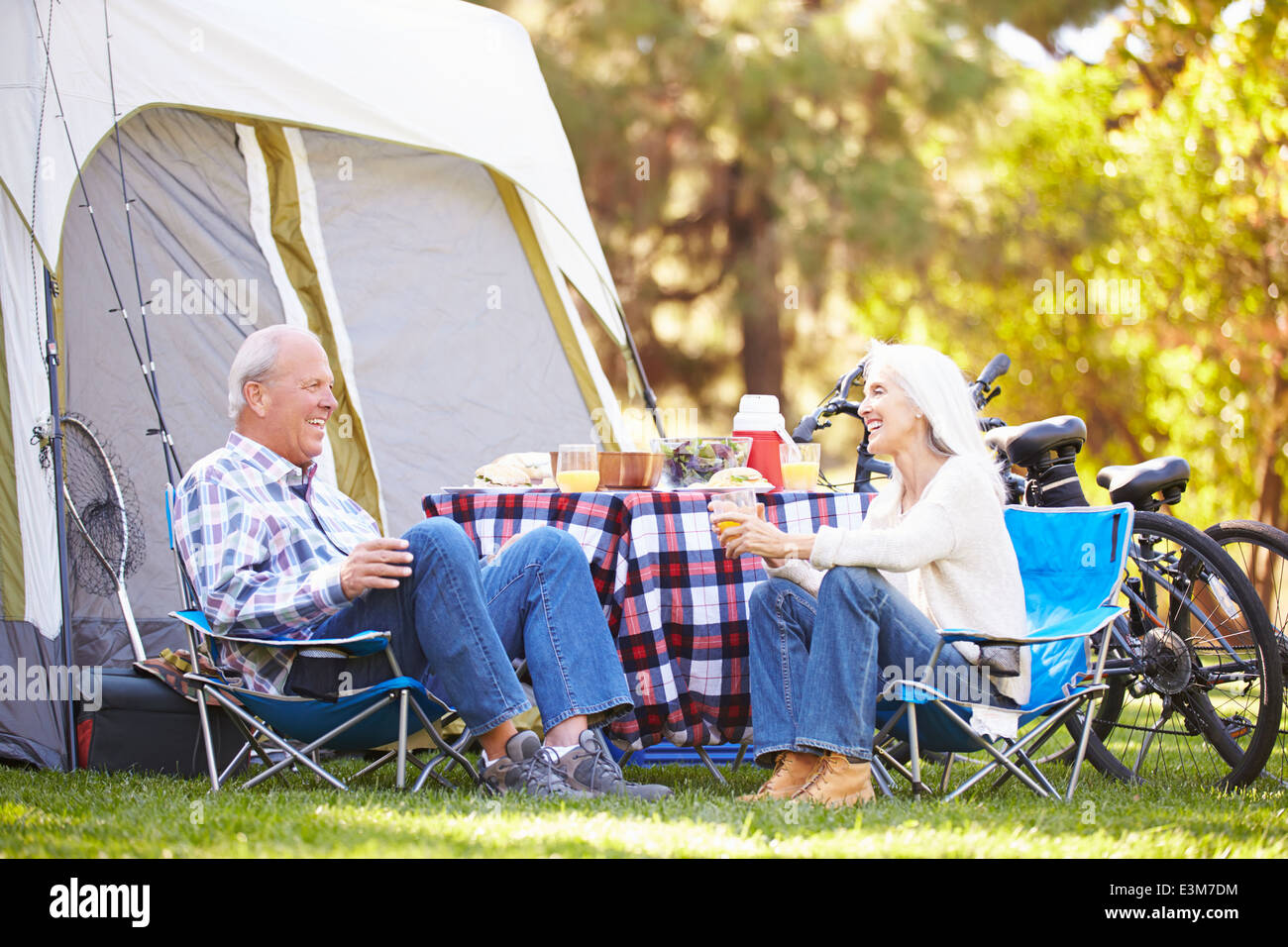 Senior Couple Enjoying Camping Holiday In Countryside Stock Photo - Alamy