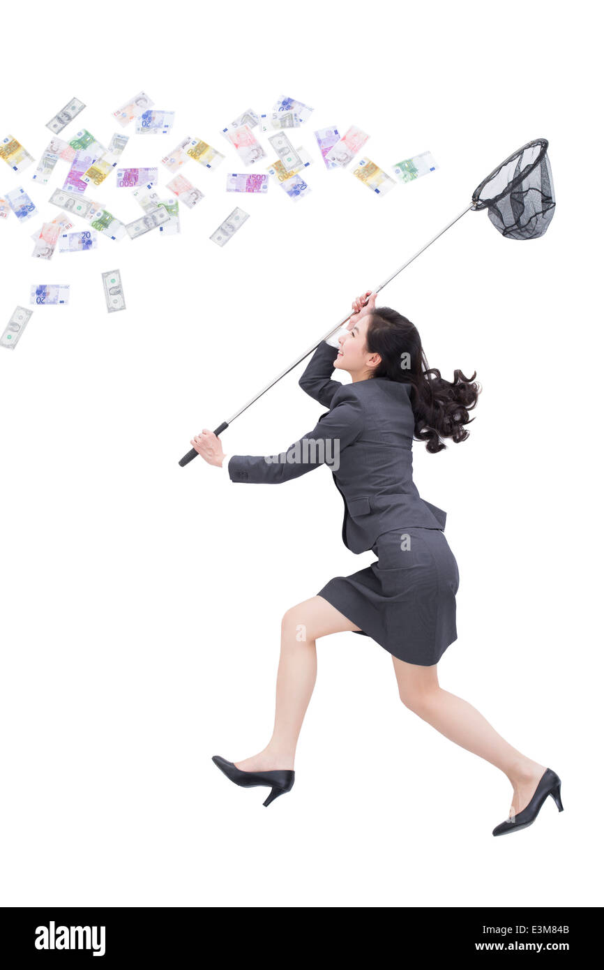 Businesswoman catching money with butterfly net Stock Photo - Alamy