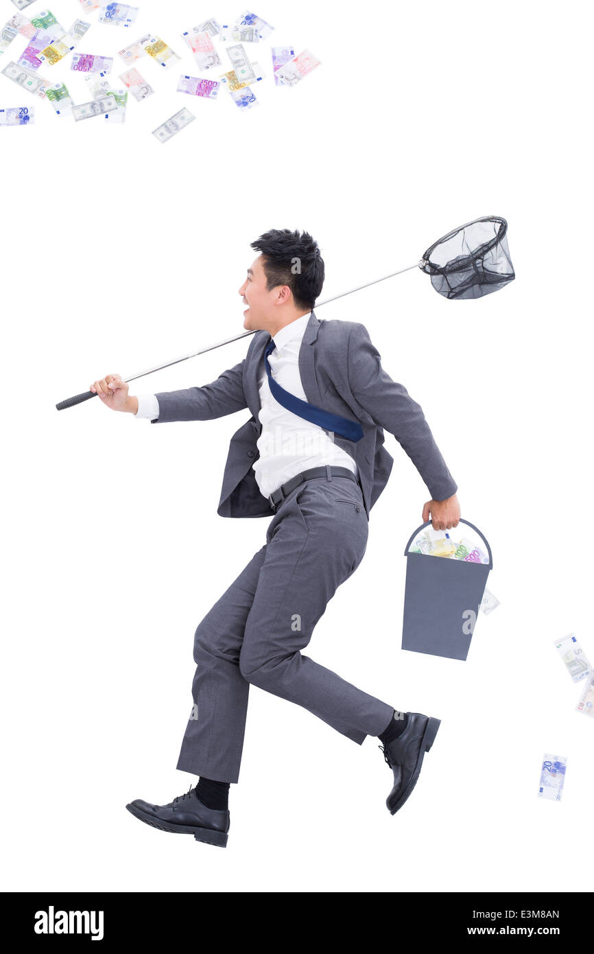 Businessman catching money with butterfly net Stock Photo - Alamy