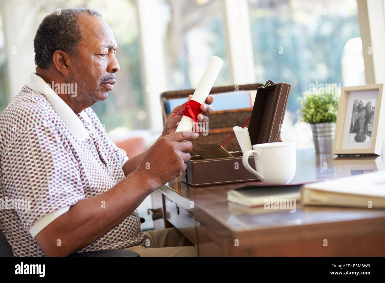Senior Man Putting Will Into Box Stock Photo - Alamy