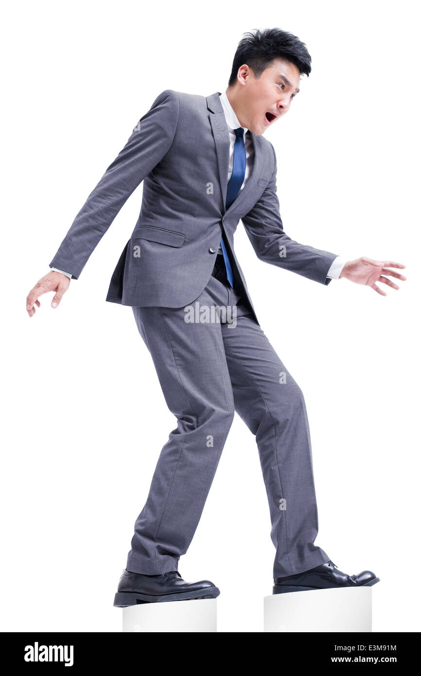 Serious businessman walking Stock Photo - Alamy