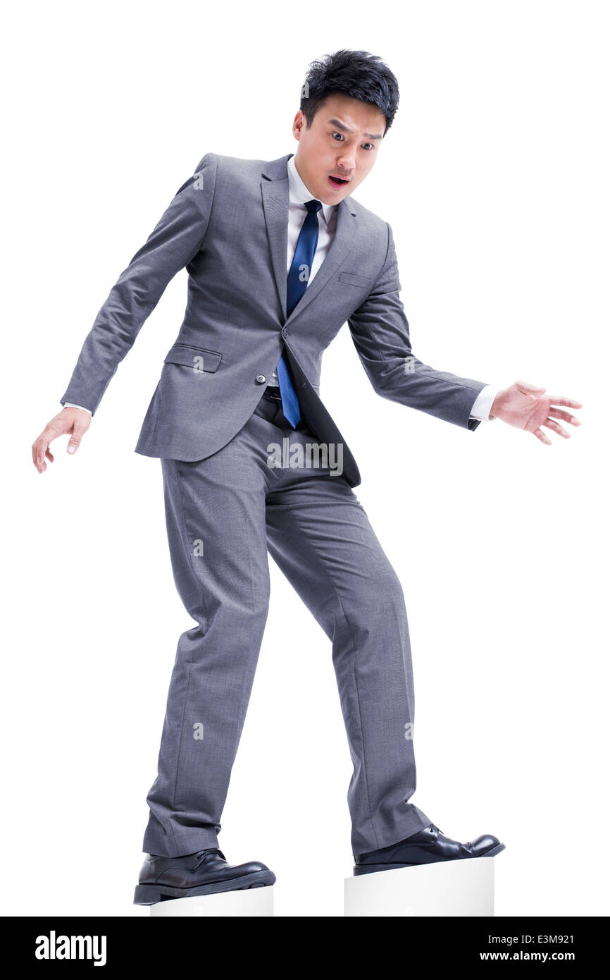 Serious businessman walking Stock Photo - Alamy
