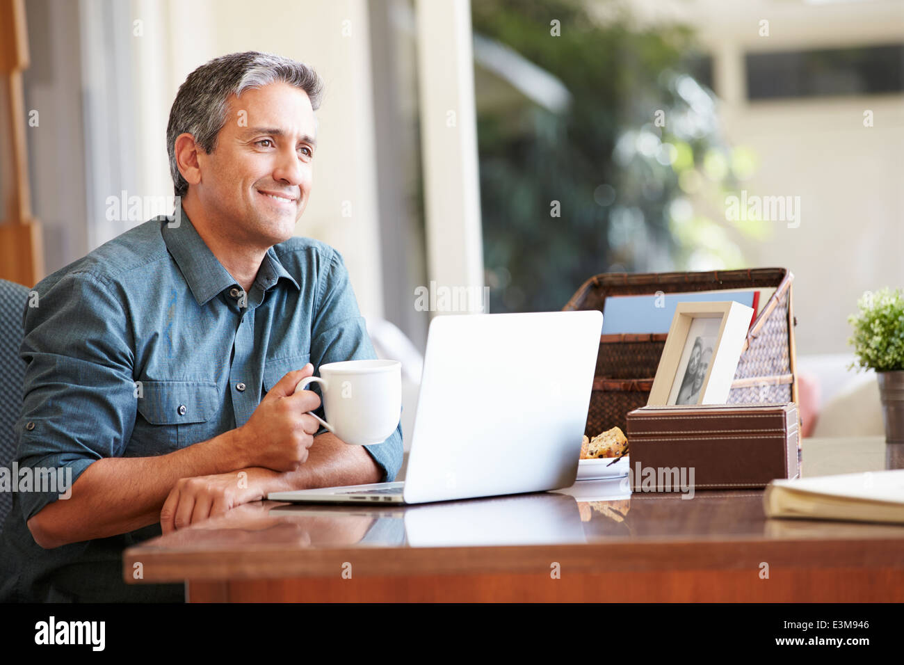 Cup tea laptop on desk hi-res stock photography and images - Alamy