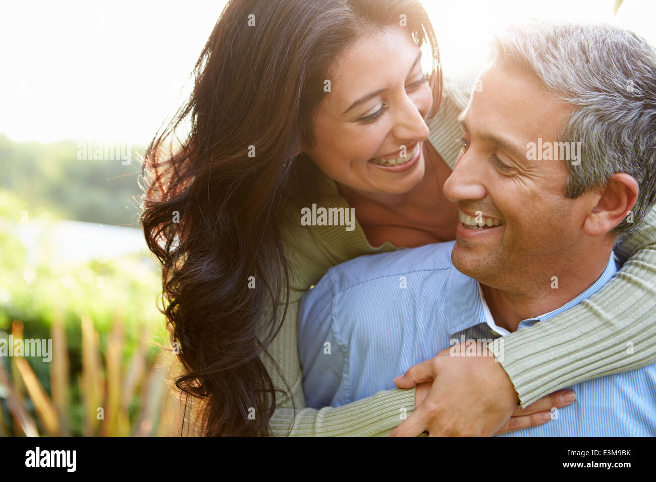 Loving Hispanic Couple In Countryside Stock Photo - Alamy