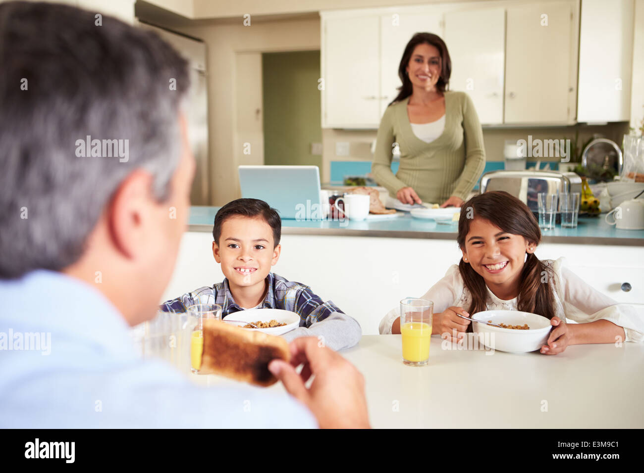 Hispanic Family Eating Breakfast At Home Together Stock Photo - Alamy