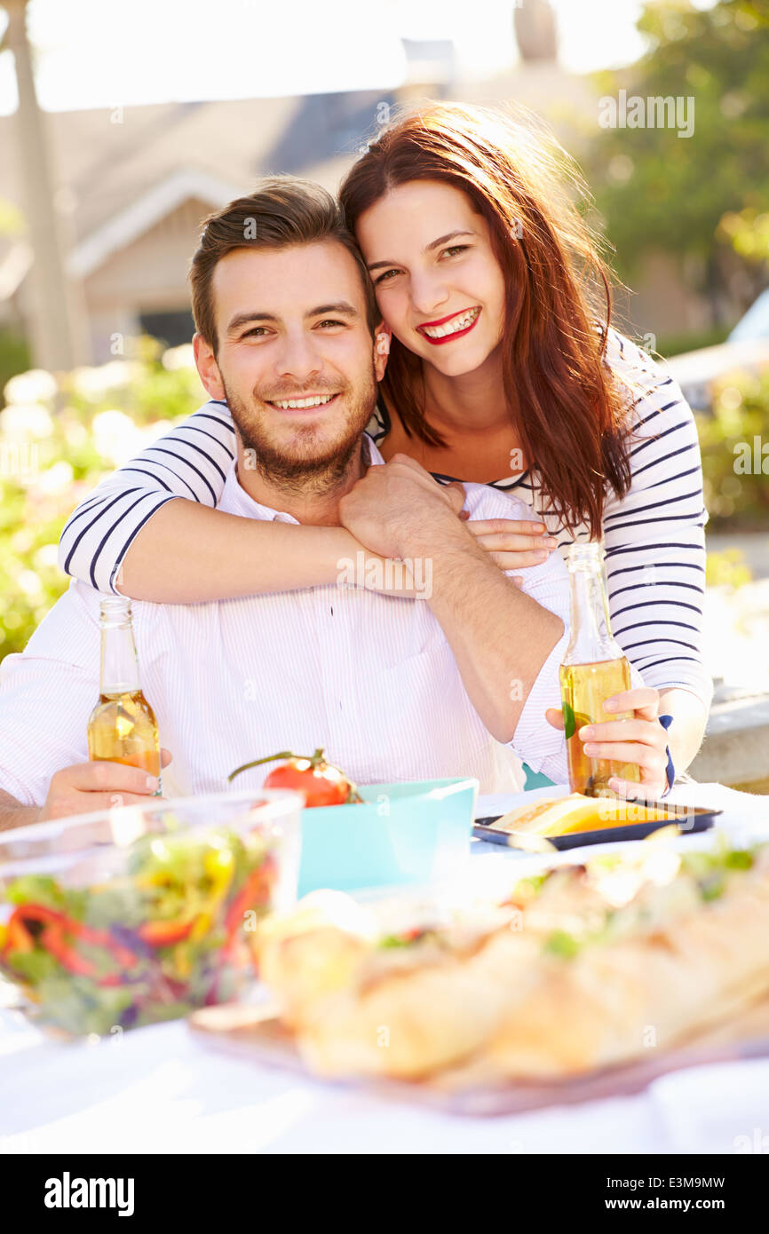 Romantic Couple Enjoying Outdoor Meal In Garden Stock Photo - Alamy