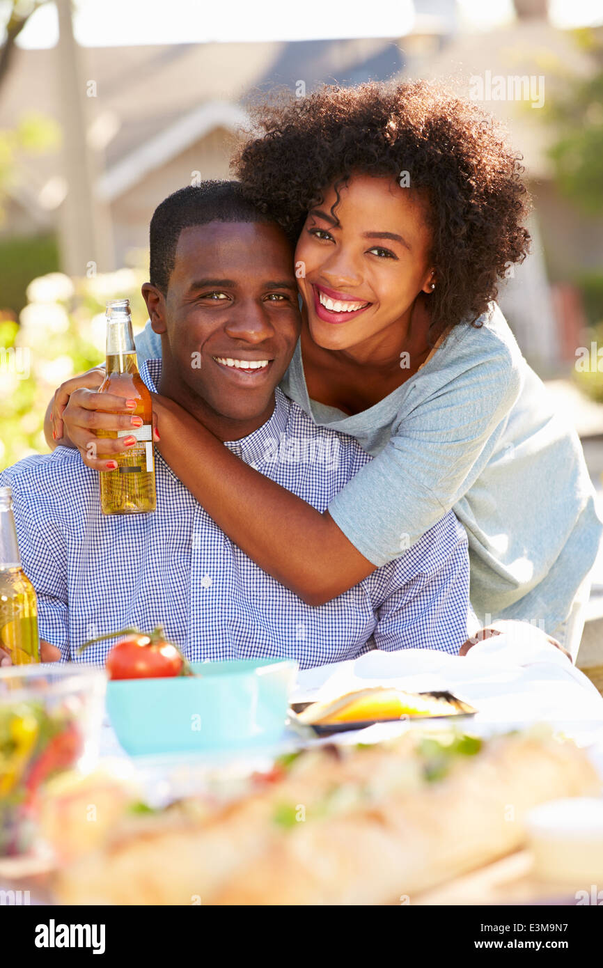 Romantic Couple Enjoying Outdoor Meal In Garden Stock Photo - Alamy