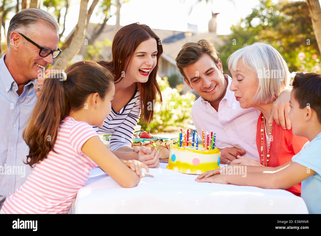 Multi-Generation Family Celebrating Birthday In Garden Stock Photo - Alamy