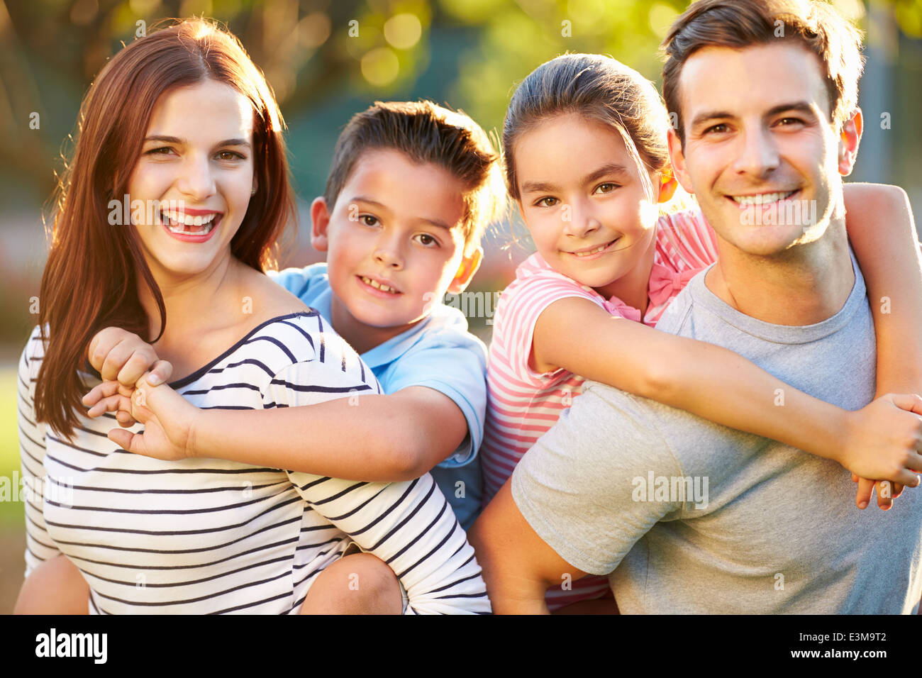 Outdoor Portrait Of Family Having Fun In Park Stock Photo - Alamy