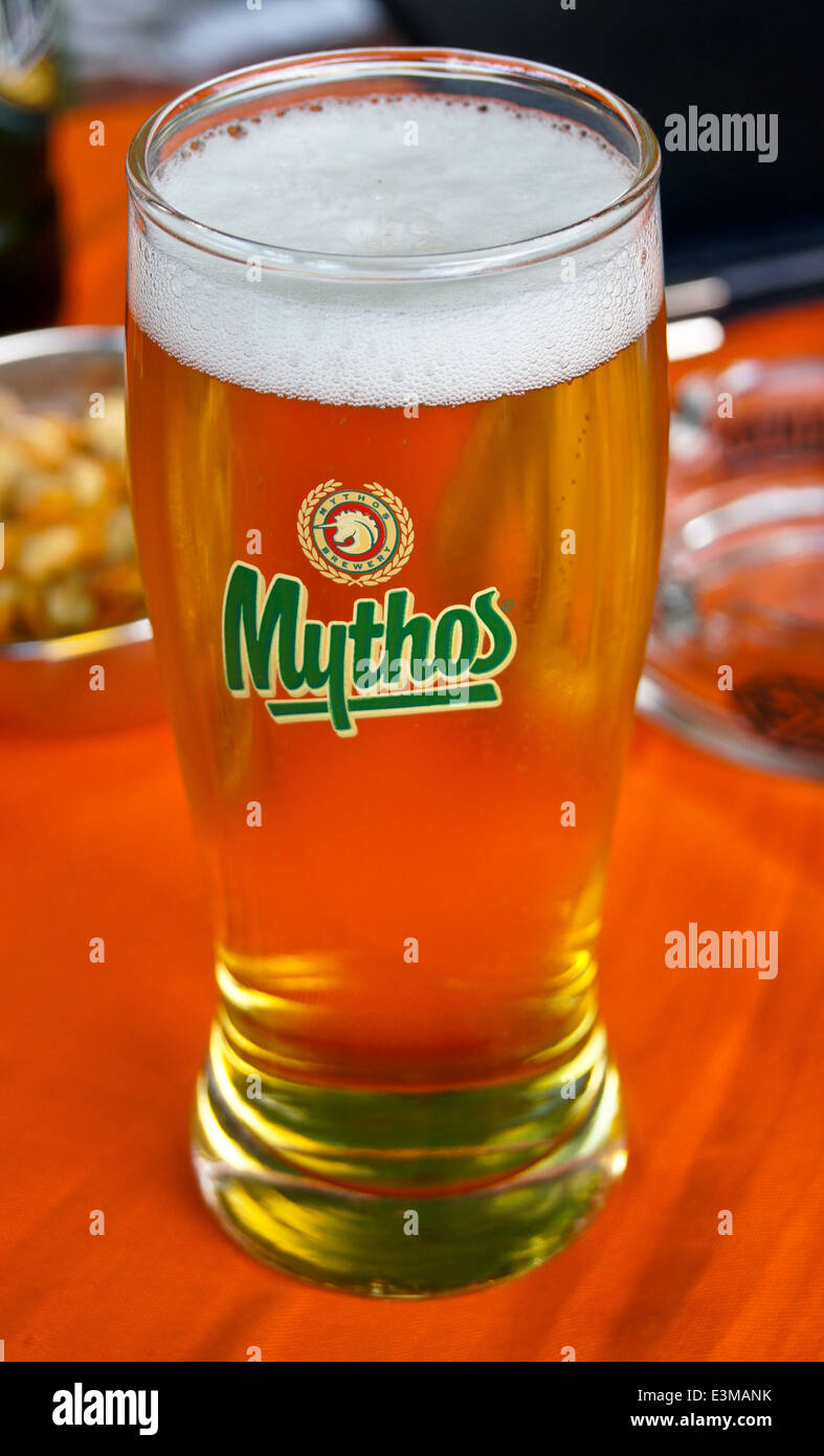 A glass of Mythos Greek beer on a bar on Kos, Greece Stock Photo - Alamy