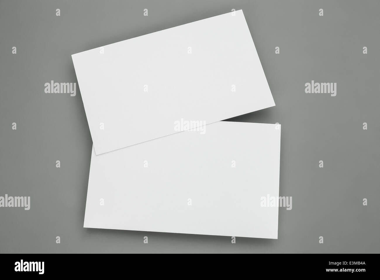blank business cards on grey background Stock Photo - Alamy