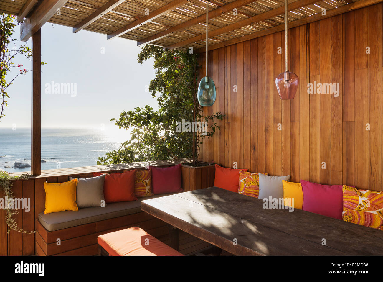 Patio bench overlooking ocean Stock Photo - Alamy