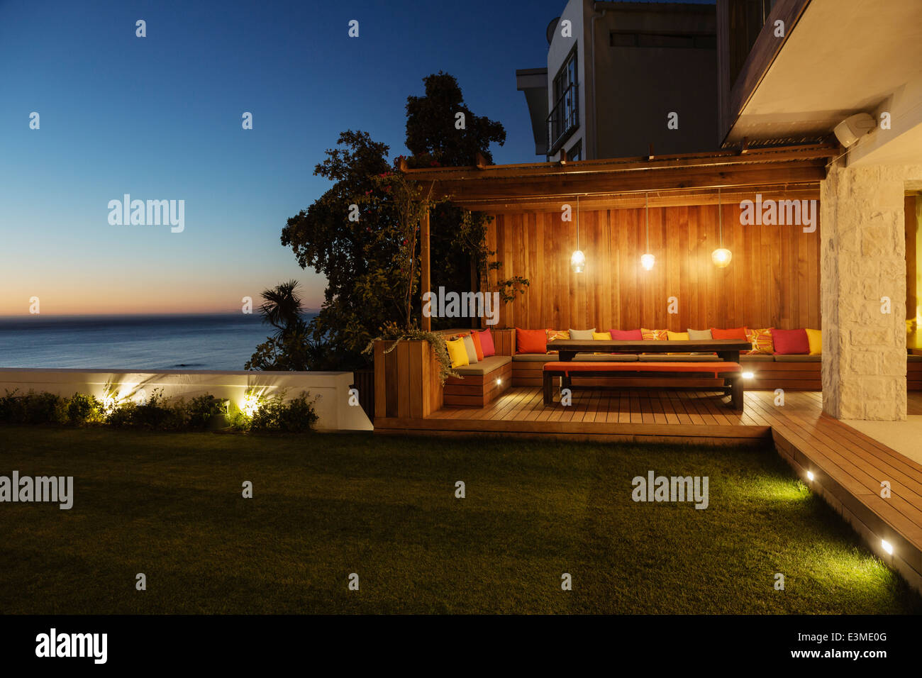 Illuminated patio at night Stock Photo - Alamy