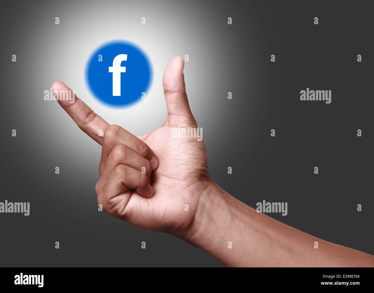 Hand showing blue color f icon Stock Photo - Alamy
