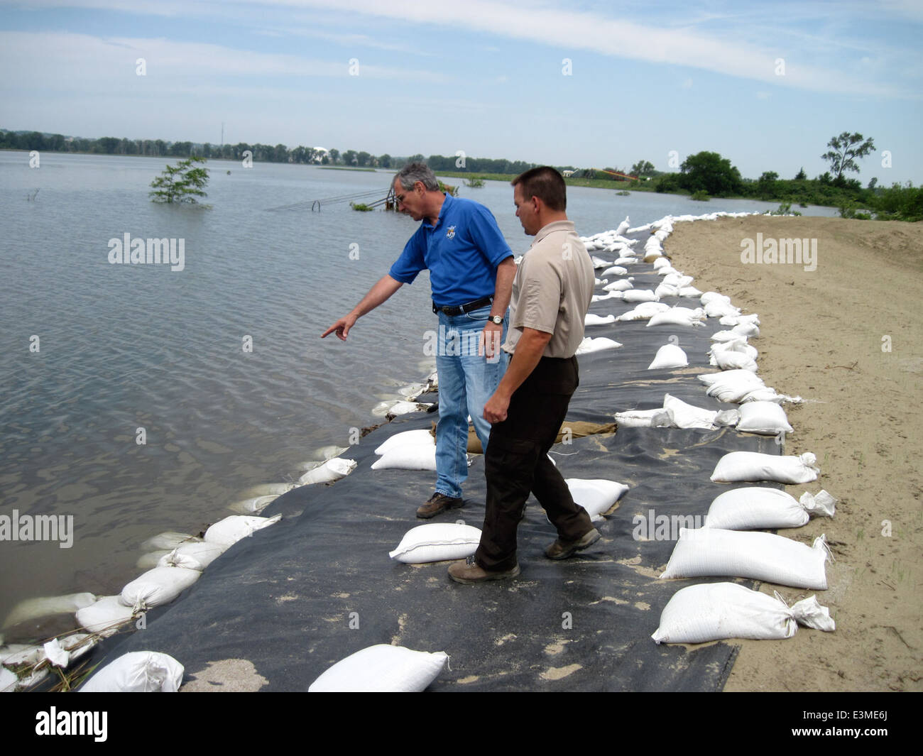 Regional Director Tom Melius inspects a temporary levee at the Missouri ...