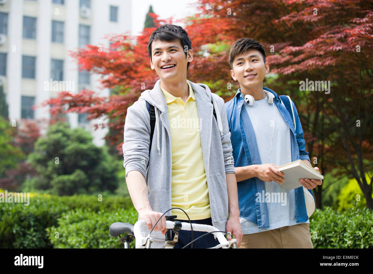 Happy college students on campus Stock Photo - Alamy