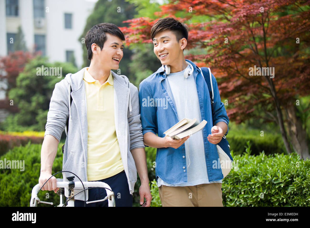 Happy college students on campus Stock Photo - Alamy