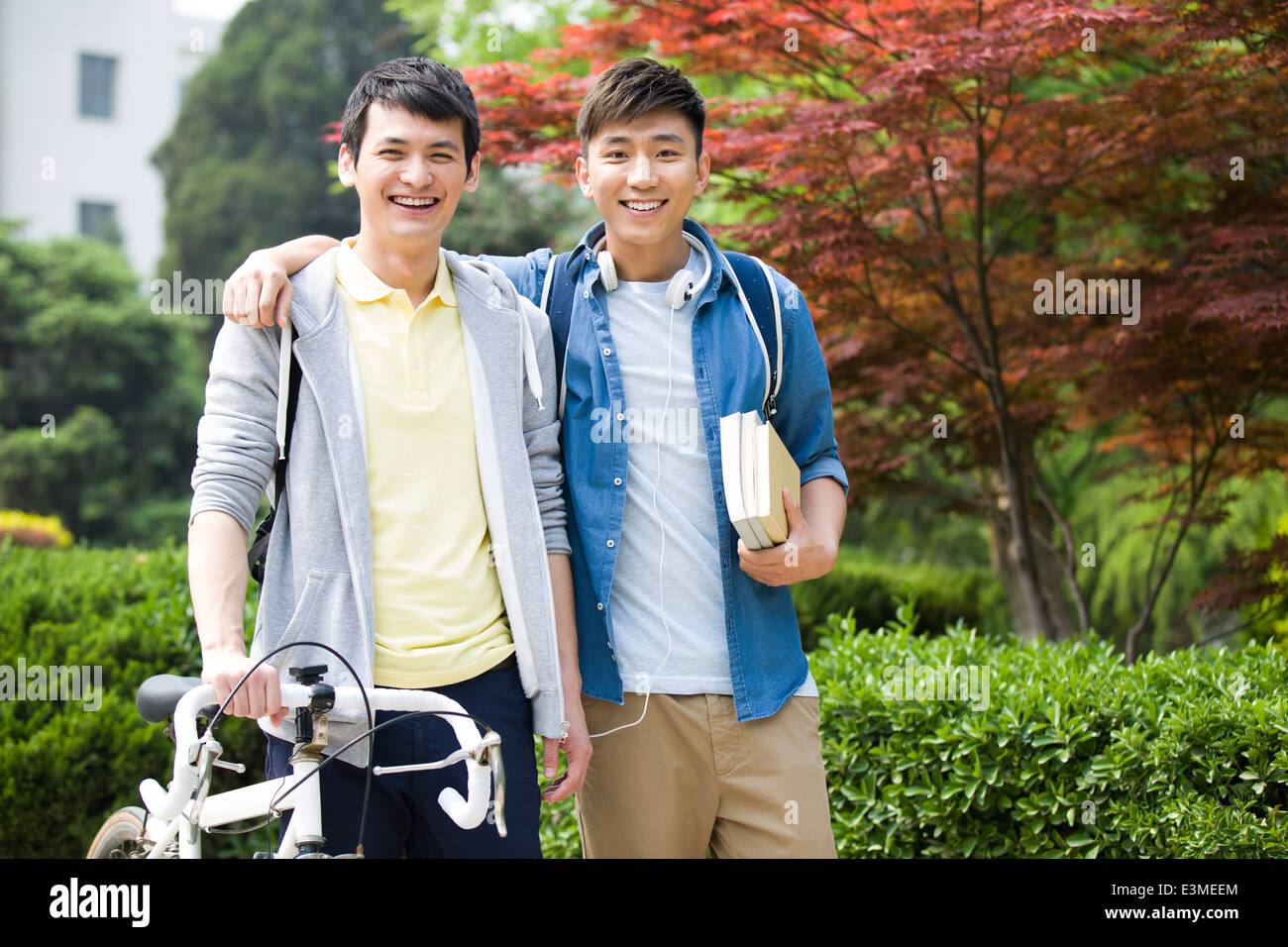 Happy college students on campus Stock Photo - Alamy
