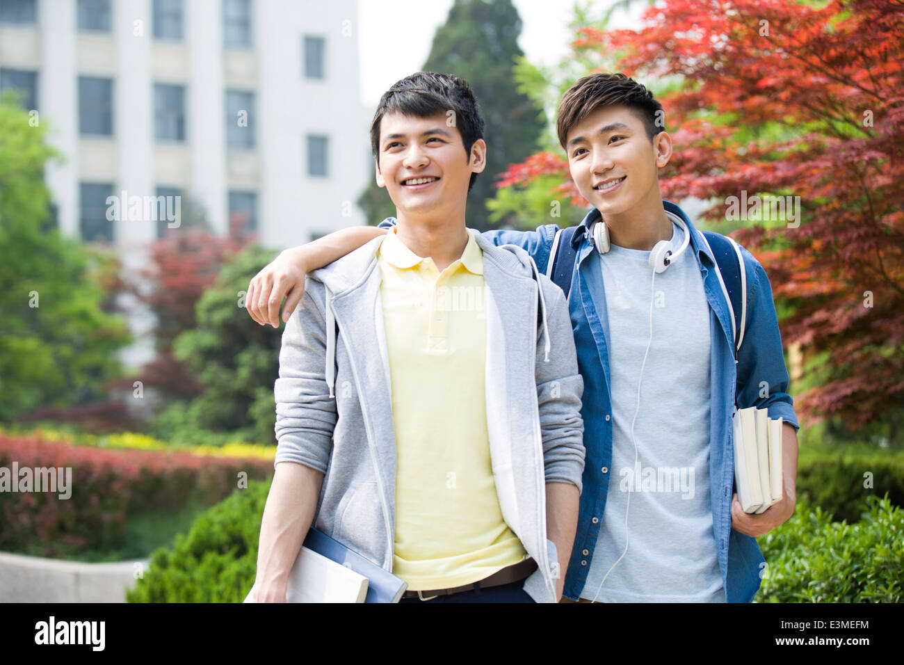 Happy college students on campus Stock Photo - Alamy