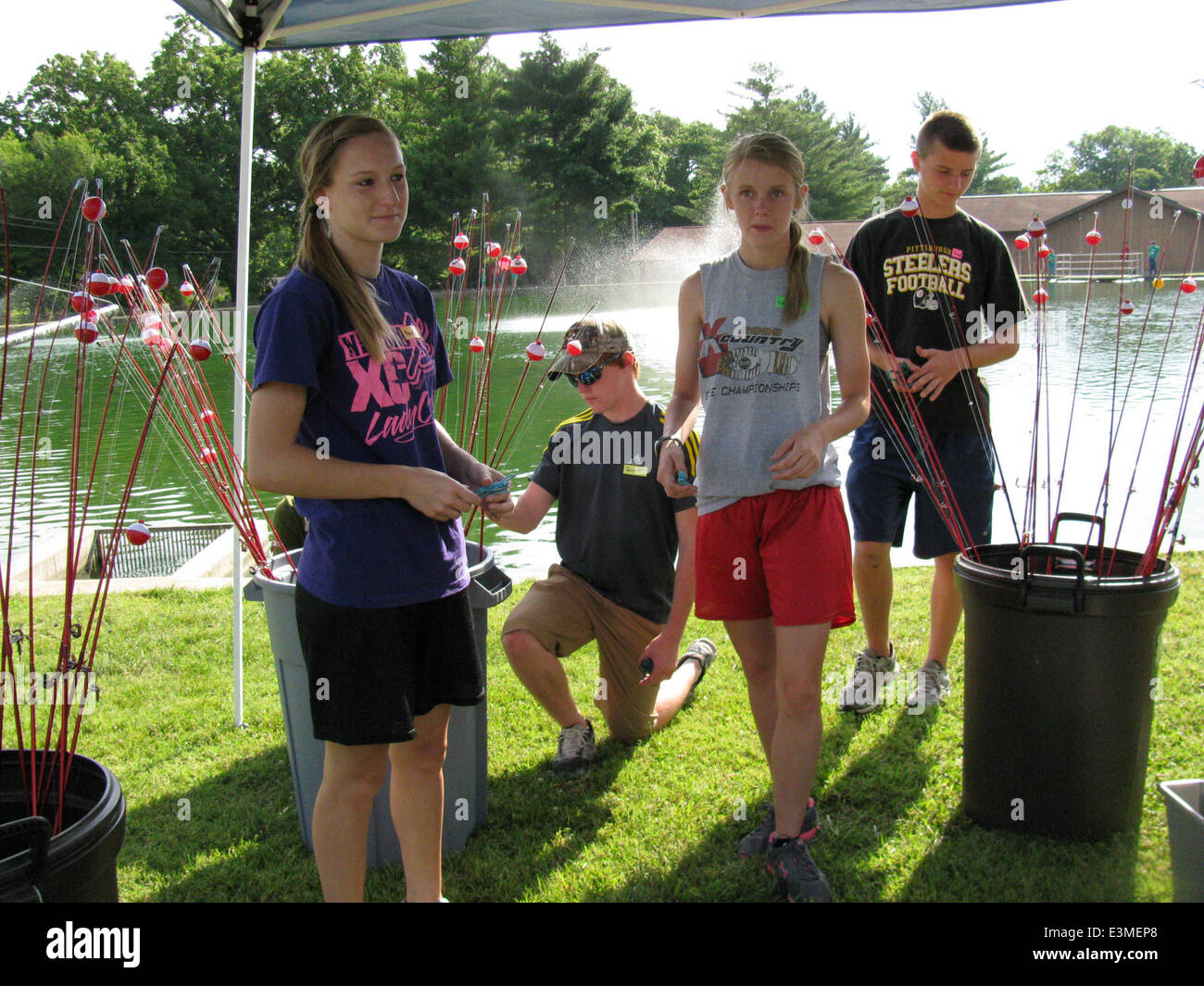 Staff at the Missouri National Fish Hatchery in Joplin work to untangle ...