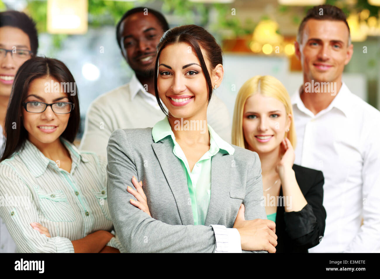 Group co workers standing in office hi-res stock photography and images ...